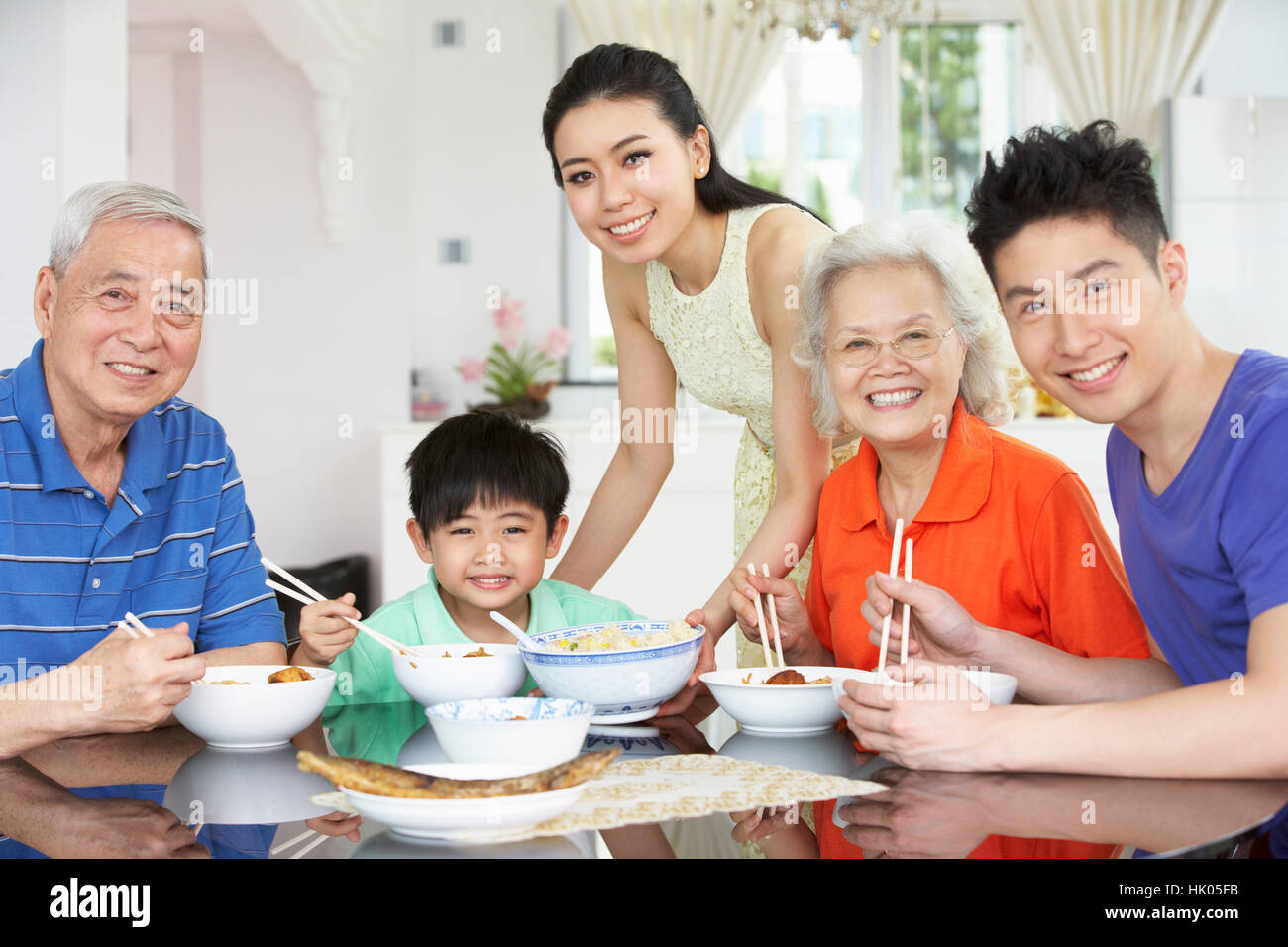 Portrait Of Multi-Generation Chinese Family Eating Meal Together Stock ...