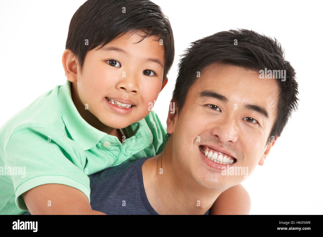 Studio Shot Of Chinese Father And Son Stock Photo - Alamy