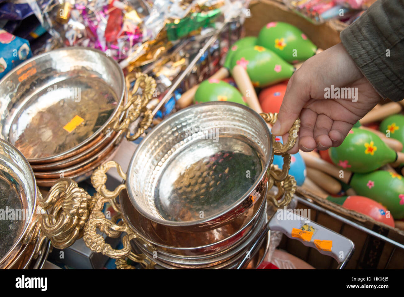 Selling new metal cookware in bazaar Stock Photo - Alamy