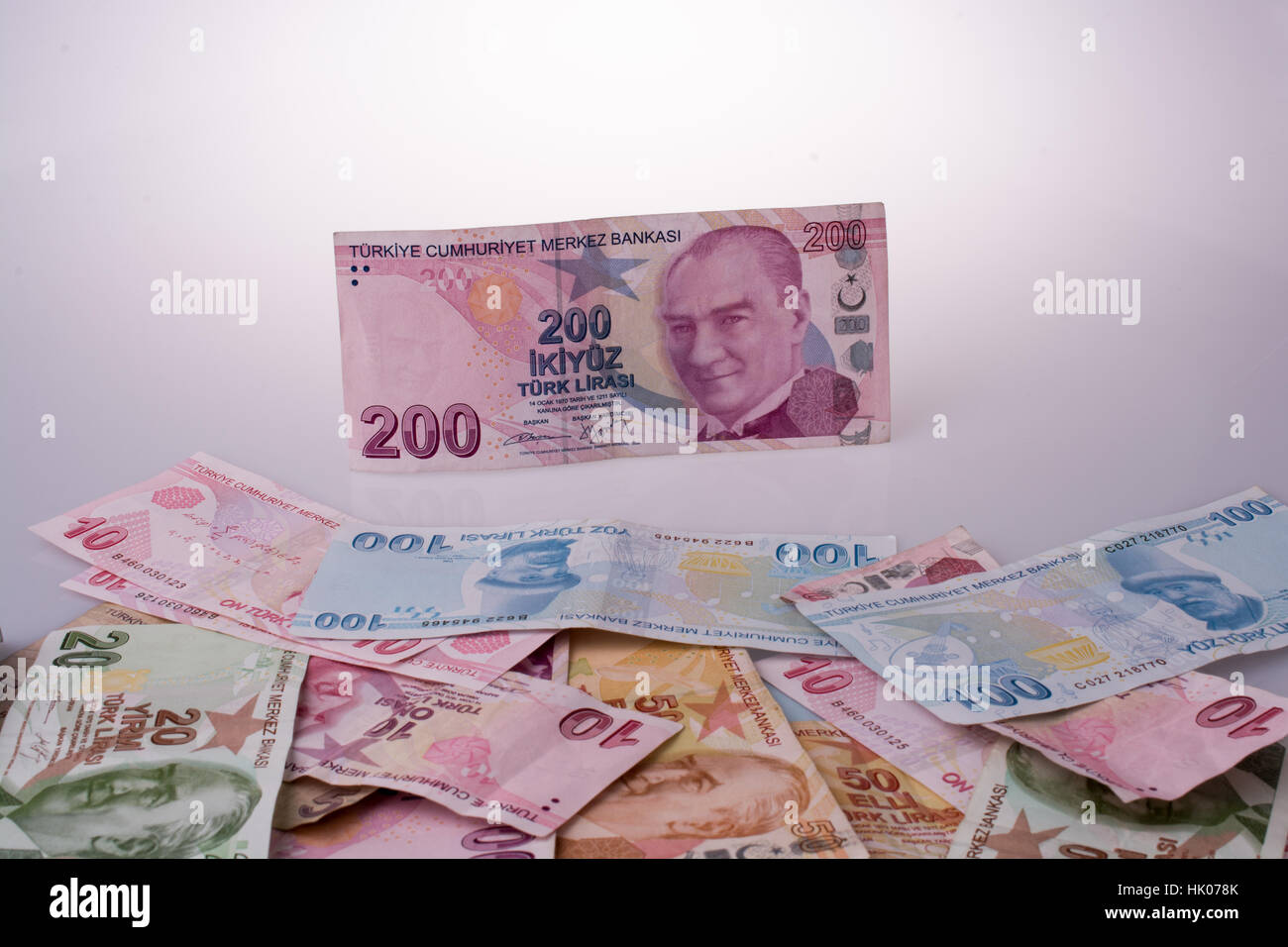 Turksh Lira banknotes of various color, pattern and value on white ...