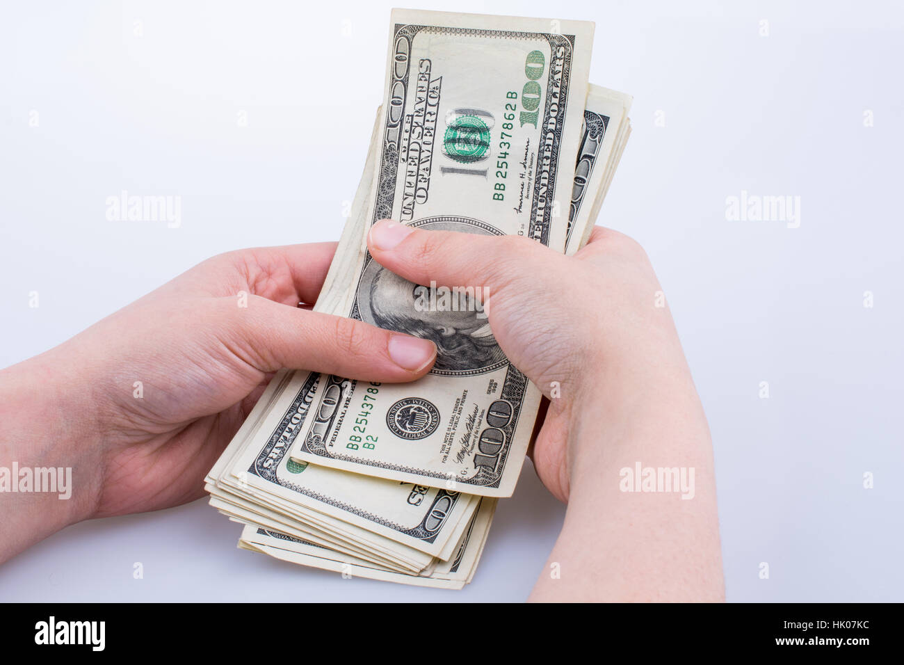 Human hand holding American dollar bill as money isolated on white ...