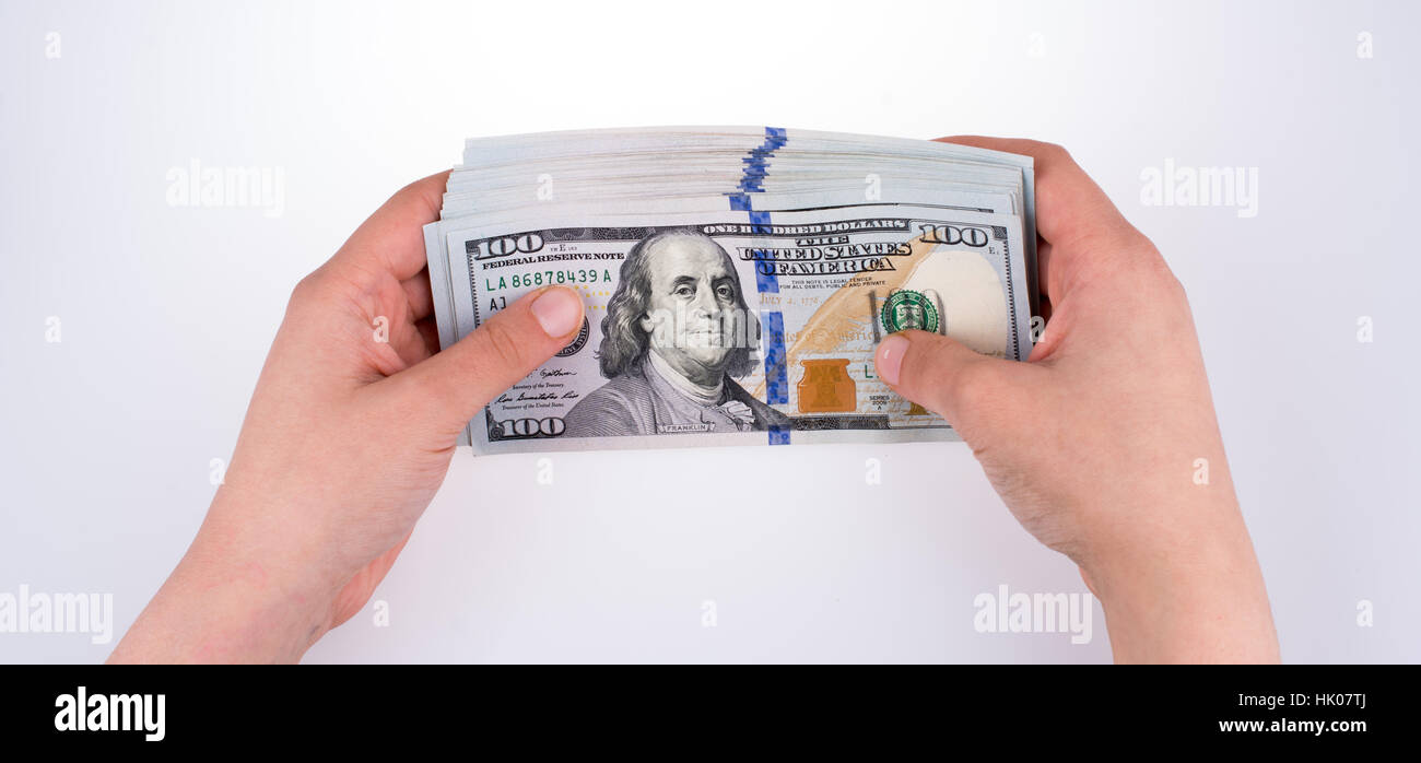 Human hand holding American dollar bill as money isolated on white ...