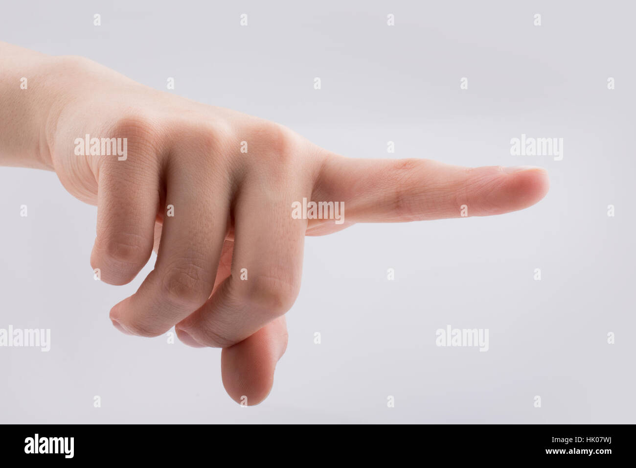 Hand pointing gesture on a white background Stock Photo - Alamy