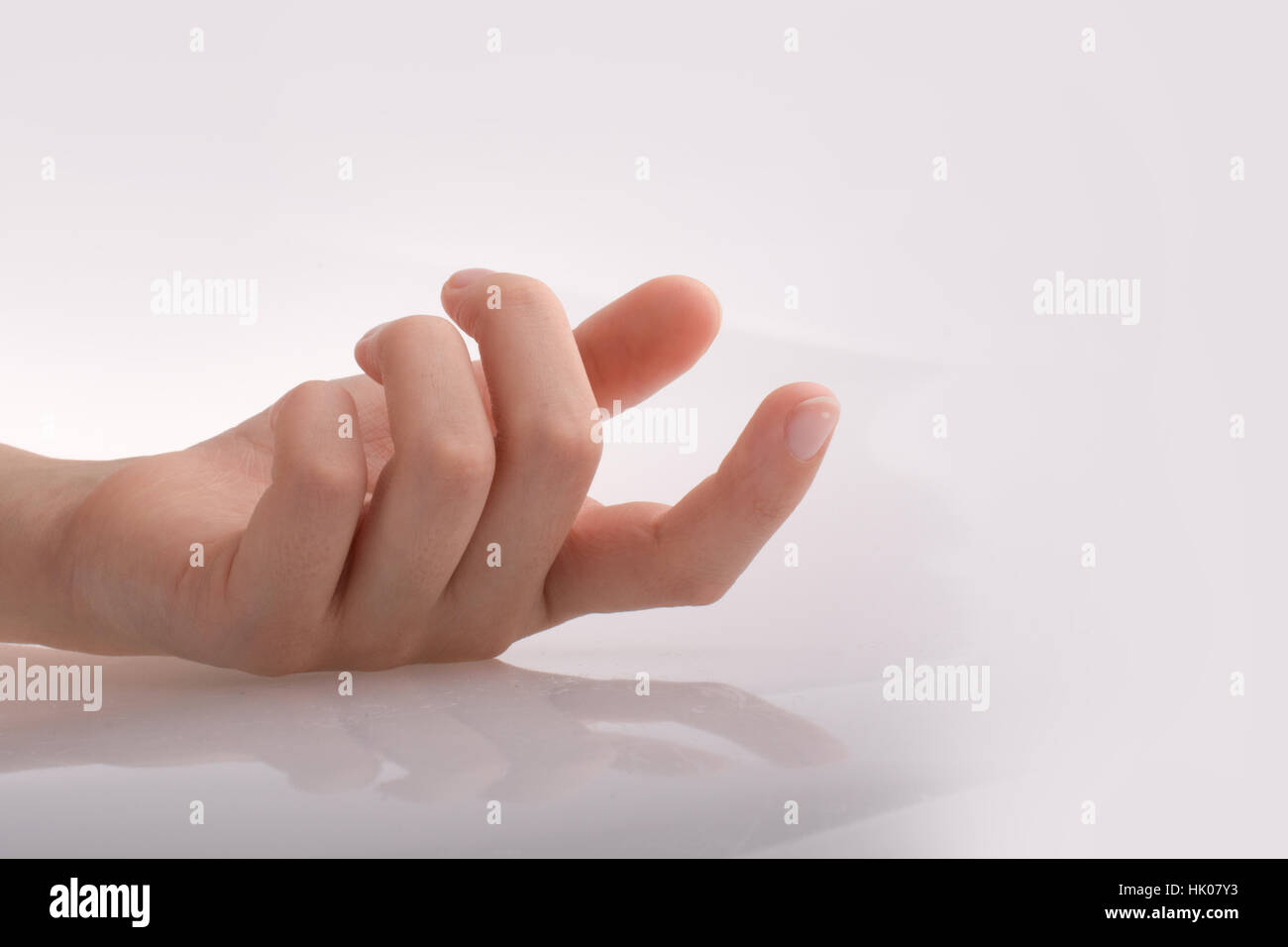 Hand loosely pointing gesture on a white background Stock Photo - Alamy