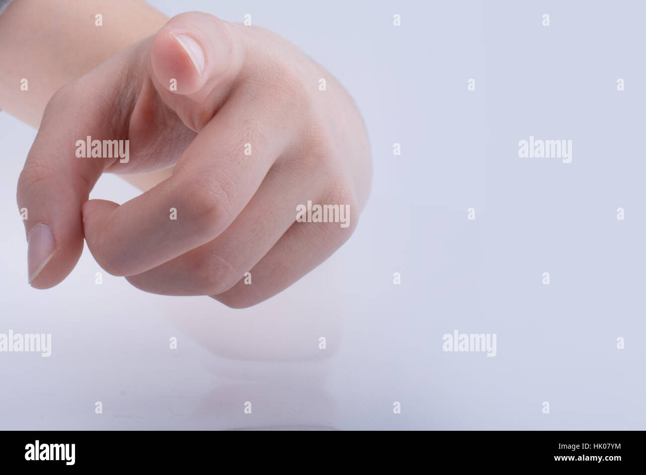 Hand pointing gesture on a white background Stock Photo - Alamy