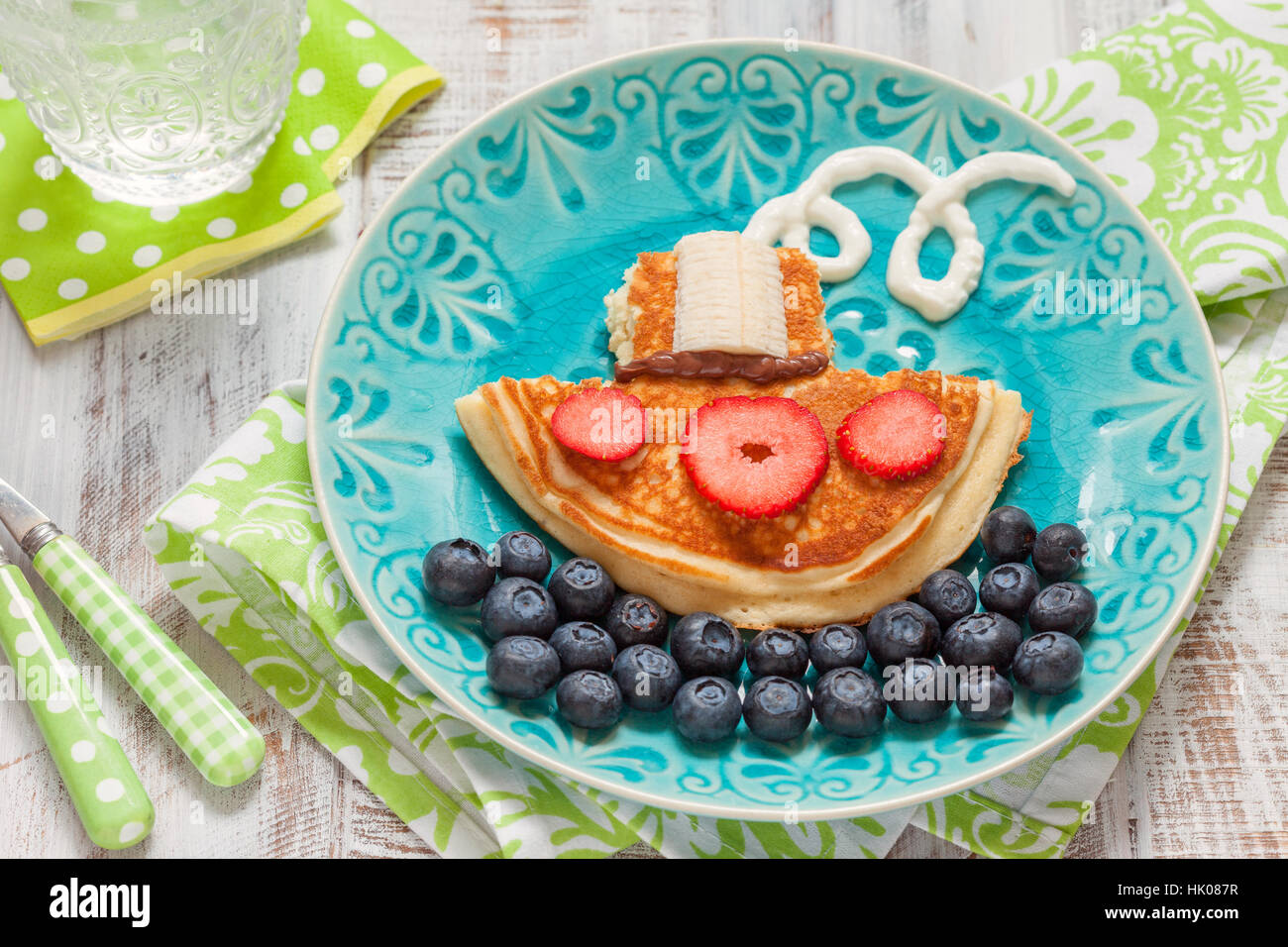Ship boat pancake with berries for kids breakfast Stock Photo - Alamy