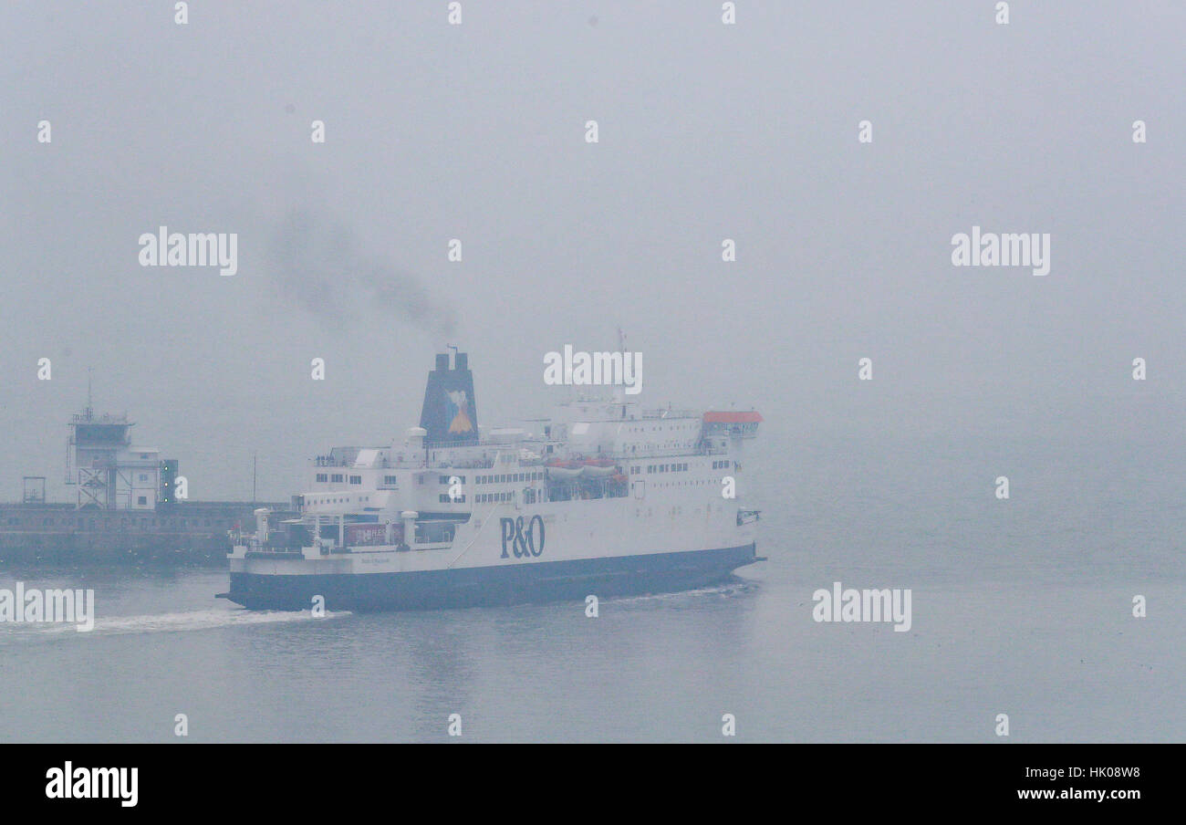 A ferry leaves the Port of Dover in Kent shrouded in fog Stock Photo ...