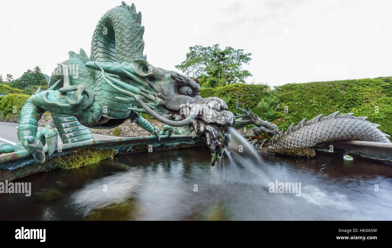 Dragon fountain with water Stock Photo - Alamy