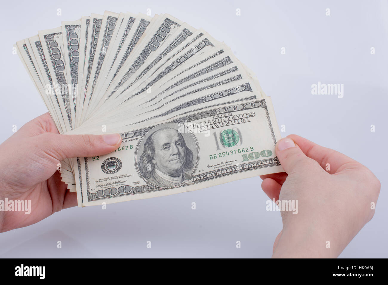 Human hand holding American dollar bill as money isolated on white ...