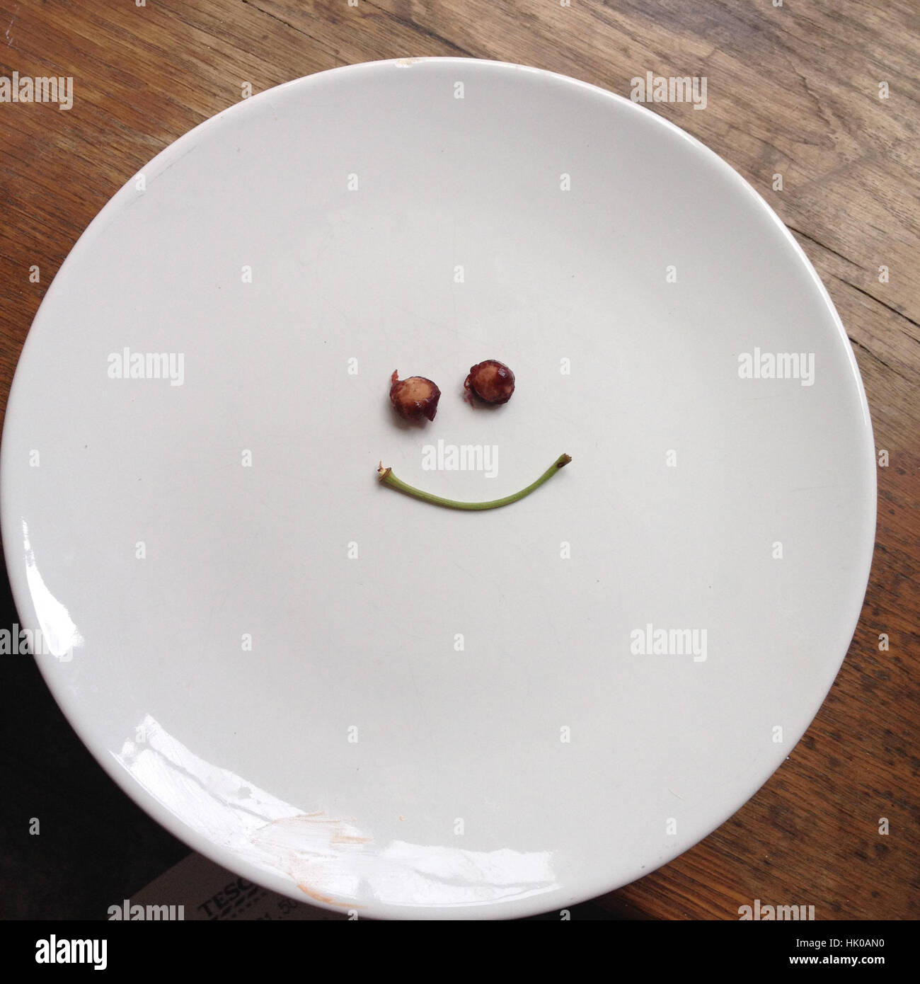 Cherry pip smile Stock Photo - Alamy