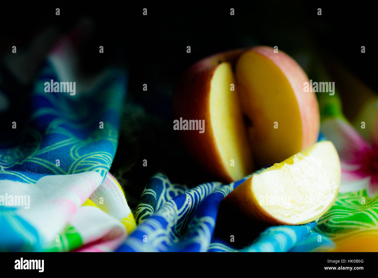 Apple and side of apple on linen with moody and dark style and ...