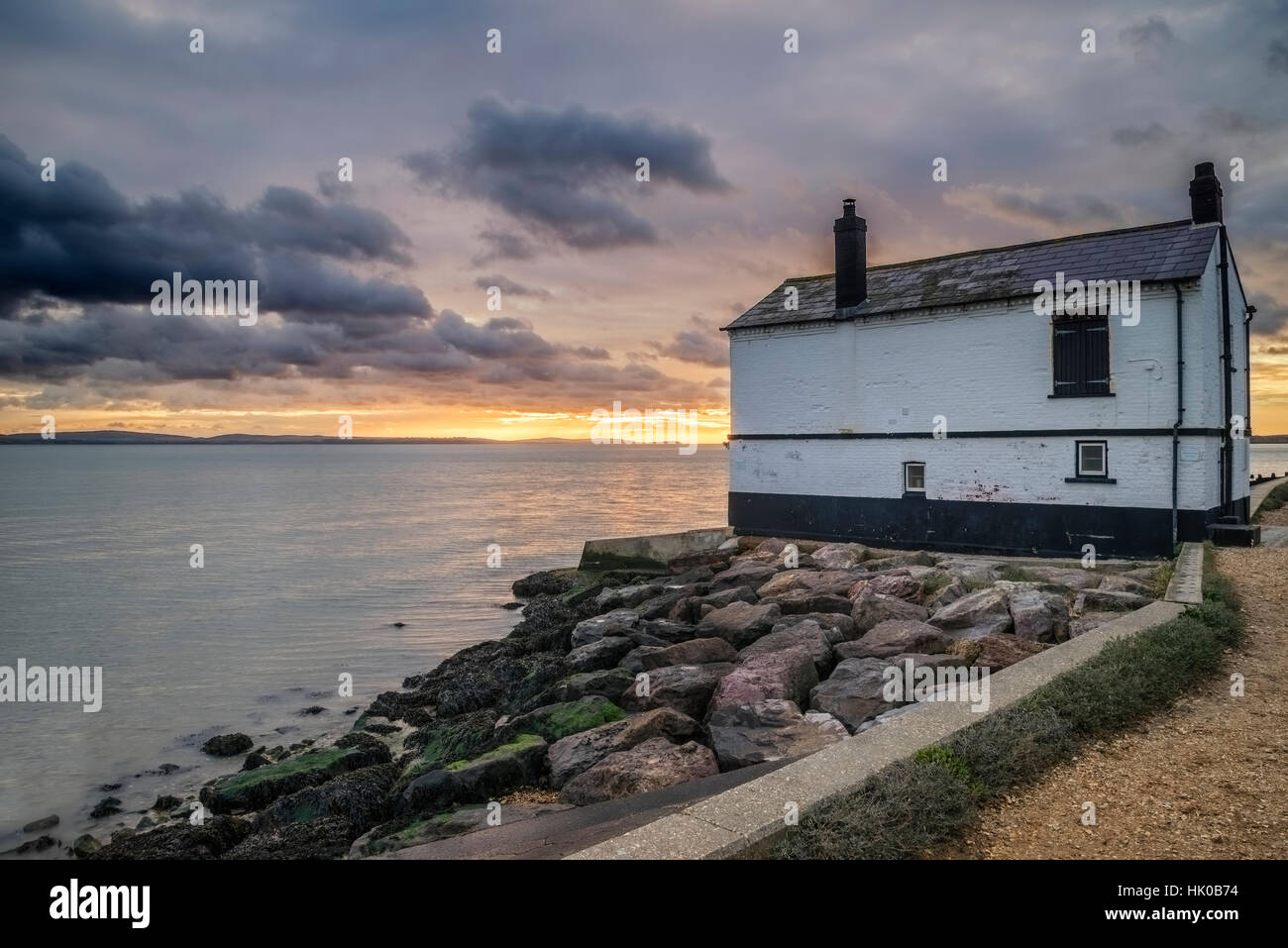 Landscape image of Old abandoned fishing house on England Solent coast ...