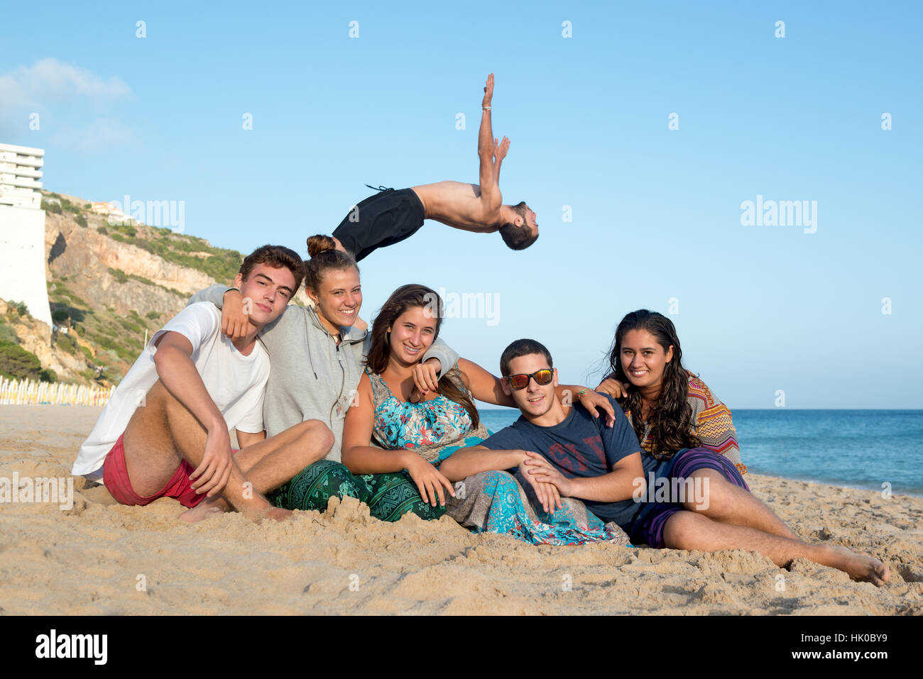 Group of happy teenage friends having fun at the beach Stock Photo - Alamy