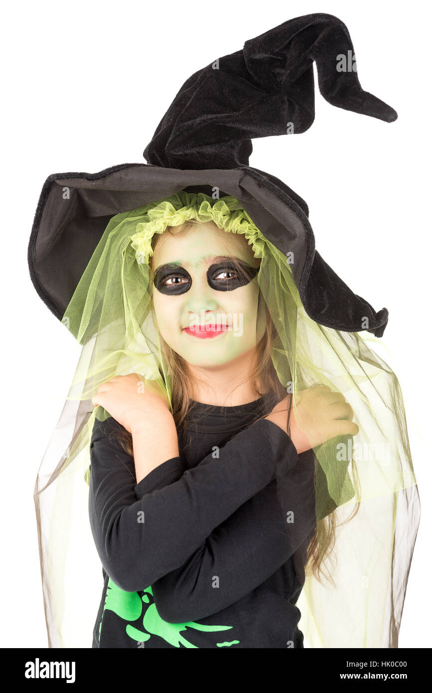 Girl with face-paint and Halloween witch costume over a white ...