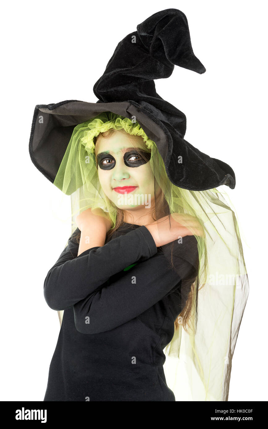 Girl with face-paint and Halloween witch costume over a white ...