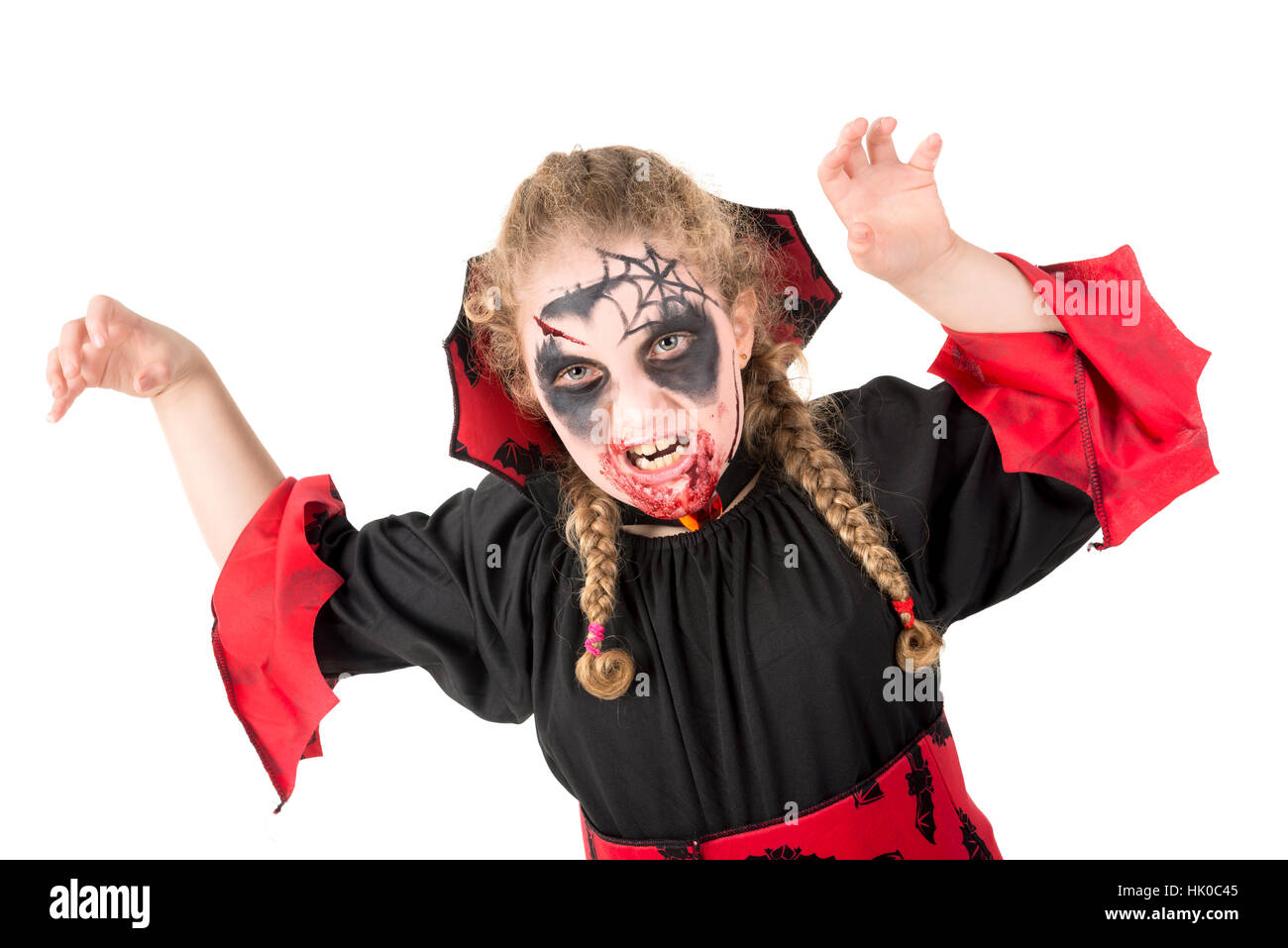Girl with face-paint and vampire Halloween costume isolated in white ...