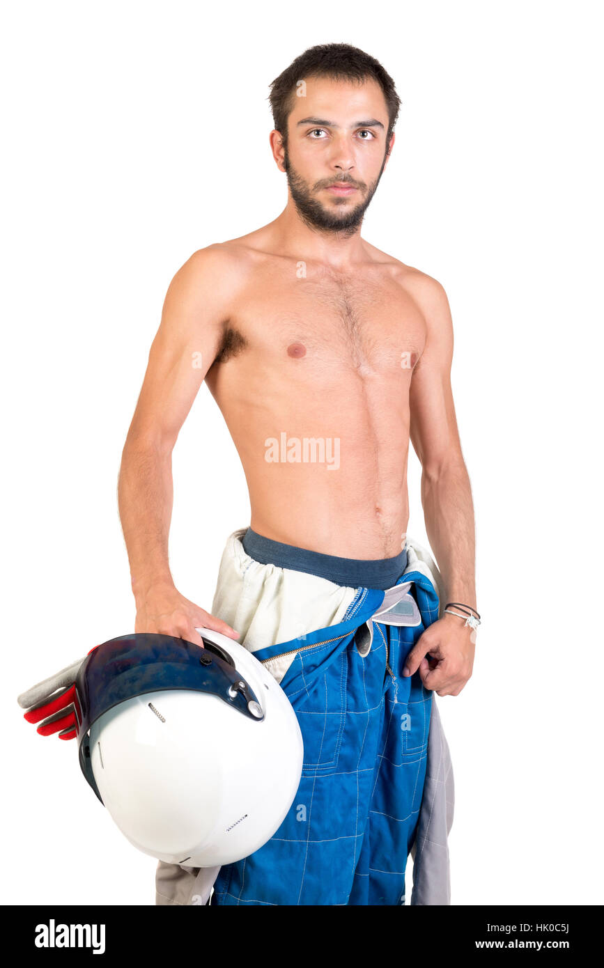 Racing driver posing with helmet isolated in white Stock Photo - Alamy