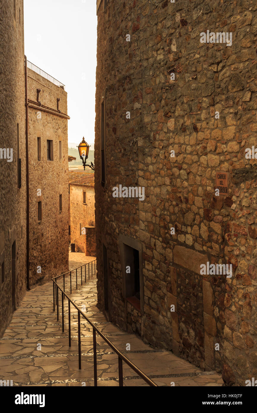 Steep and narrow winding street in gorgeous medieval hilltop walled ...