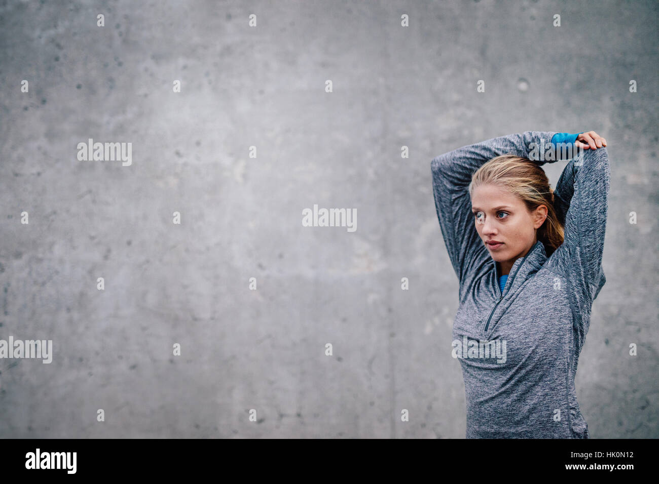 Female runner stretching arms after a running session. Young sports ...