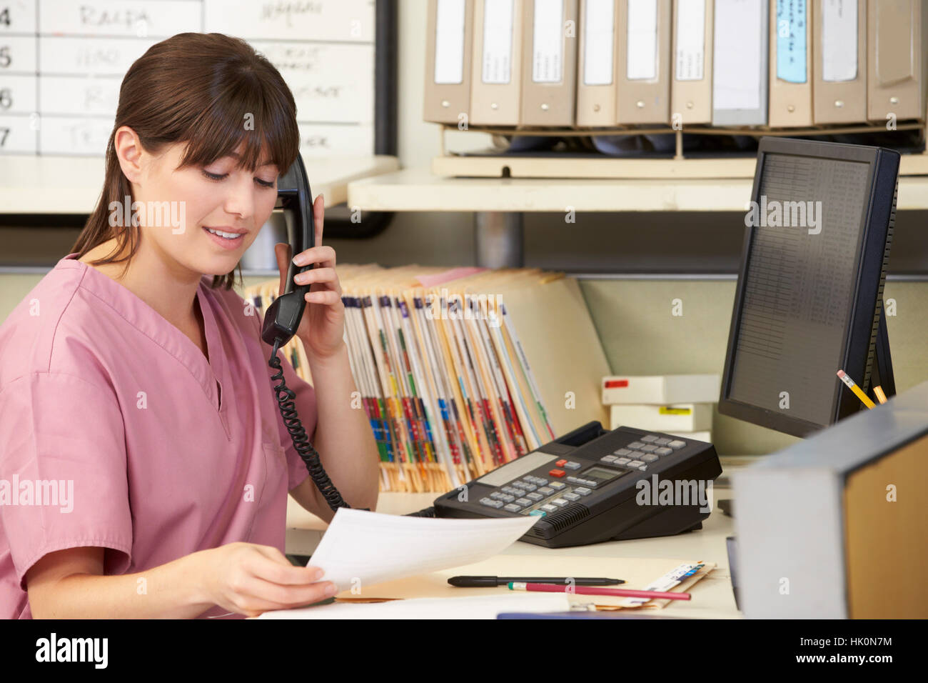 Doctor talking nurses sitting hi-res stock photography and images - Alamy