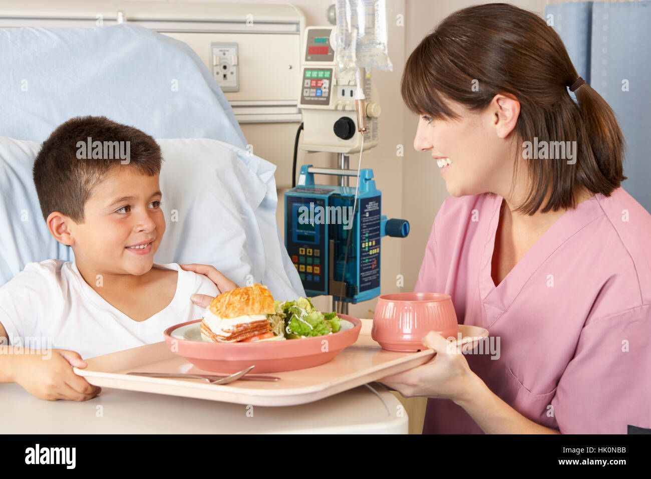 Female nurse serving food patient hi-res stock photography and images ...