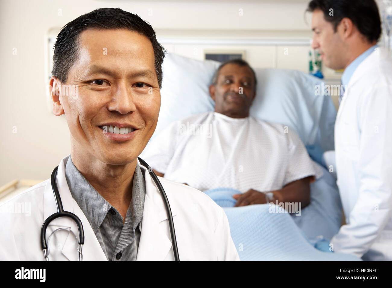 Portrait Of Doctor With Patient In Background Stock Photo - Alamy