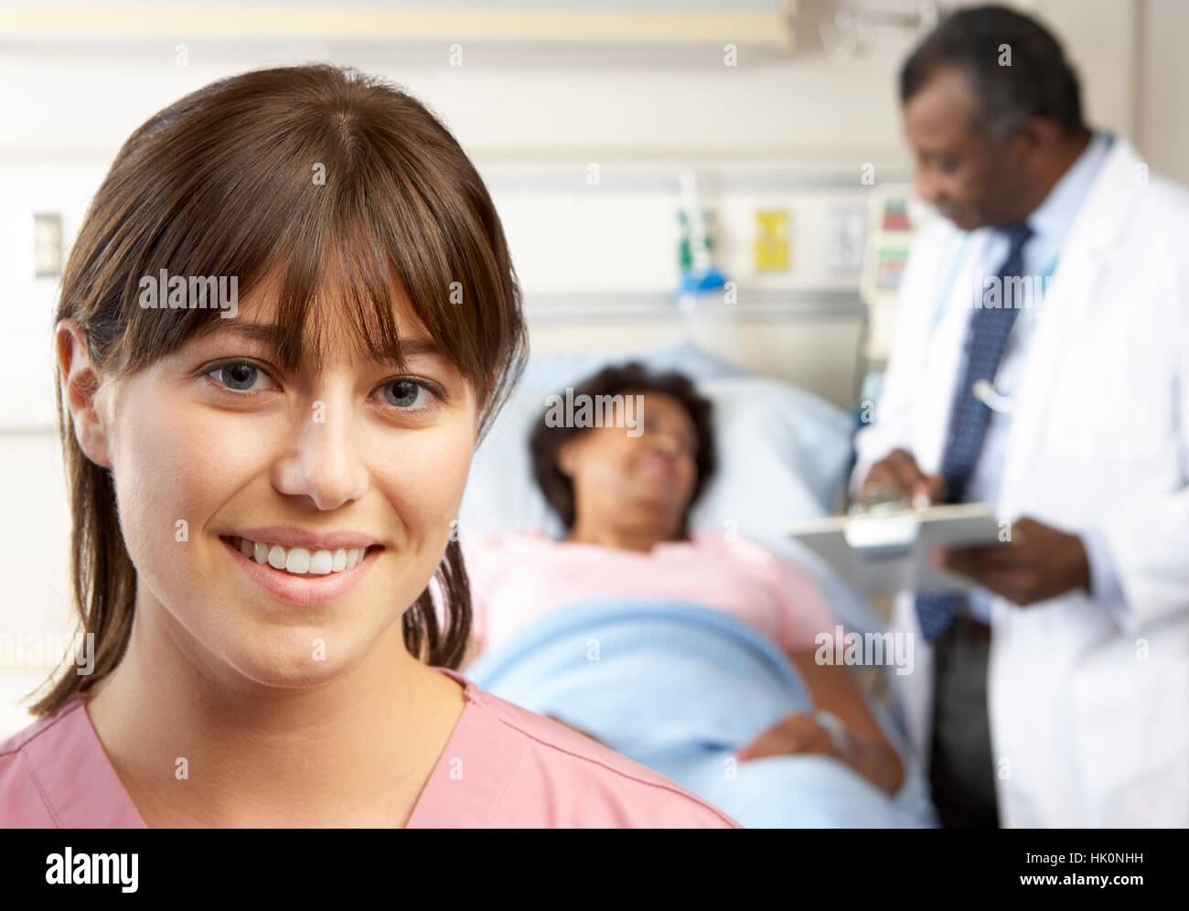 Portrait Of Nurse With Patient In Background Stock Photo - Alamy
