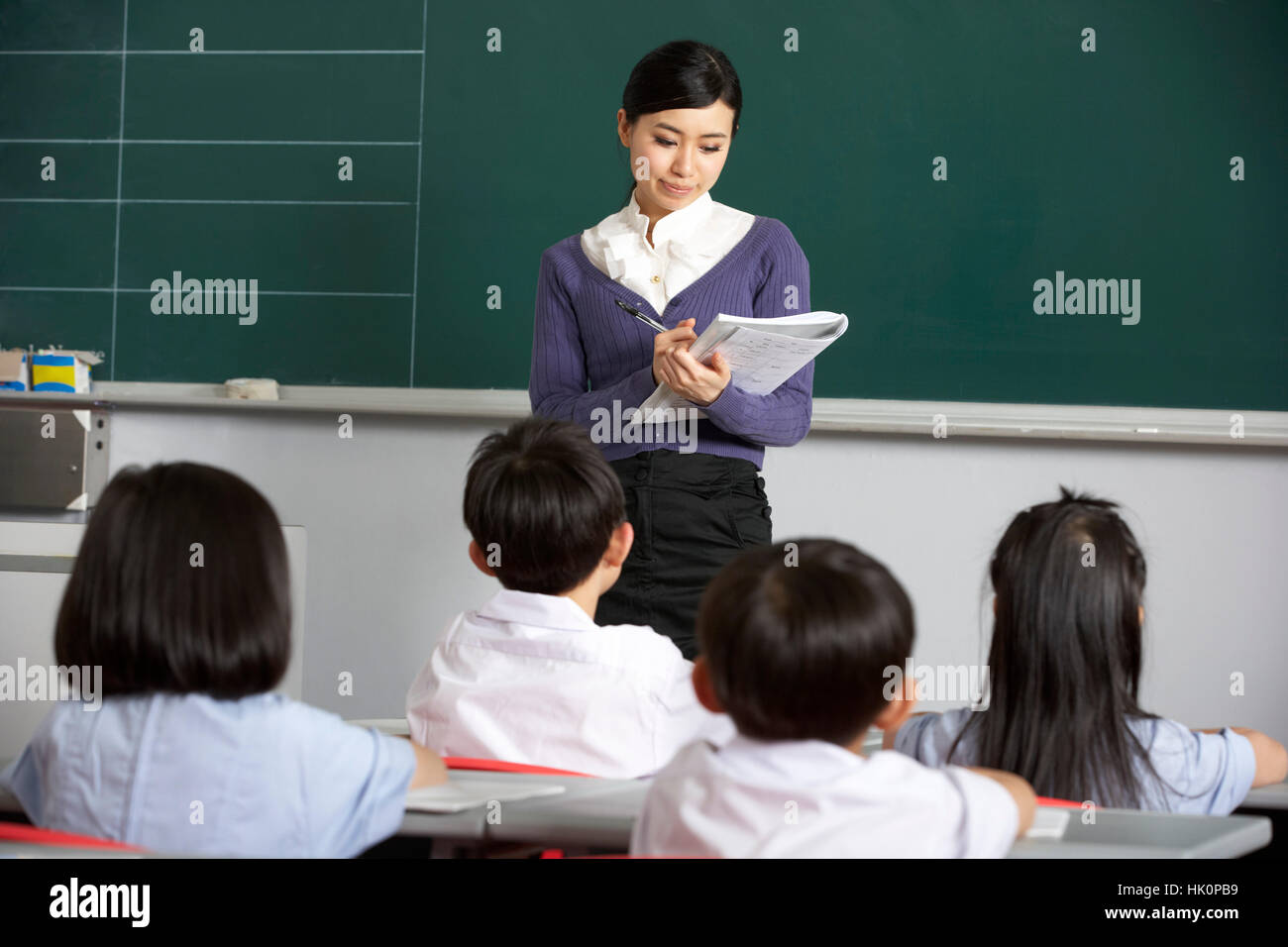 Teacher With Students In Chinese School Classroom Stock Photo - Alamy
