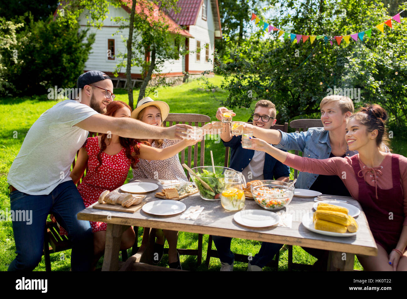 happy friends having party at summer garden Stock Photo - Alamy