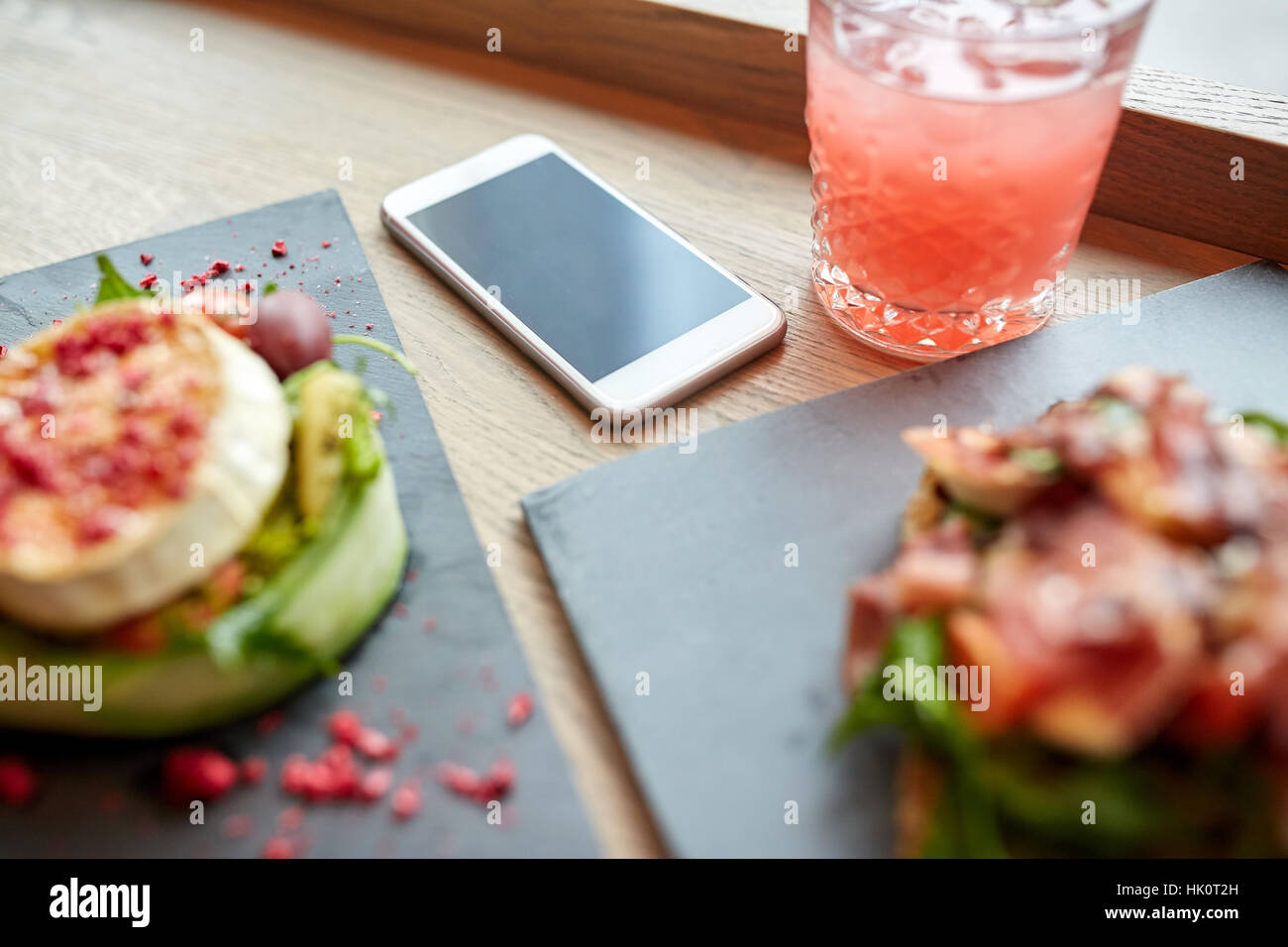 Mobile phone dinner table still life hi-res stock photography and ...