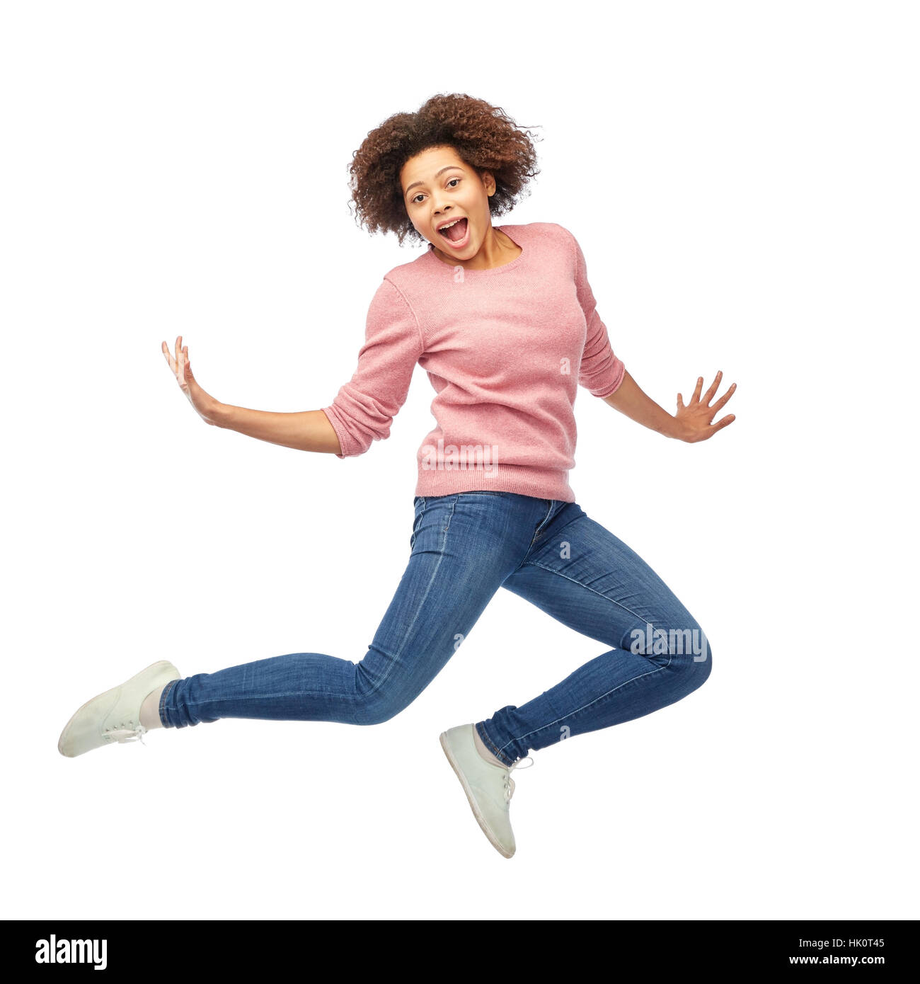 happy african american woman jumping over white Stock Photo - Alamy