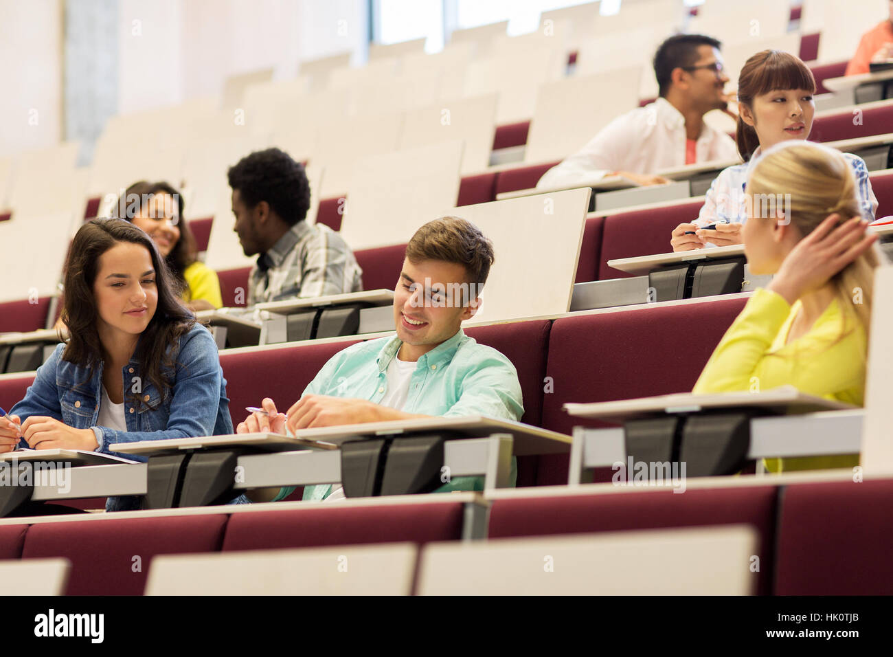 group of students with notebooks in lecture hall Stock Photo - Alamy