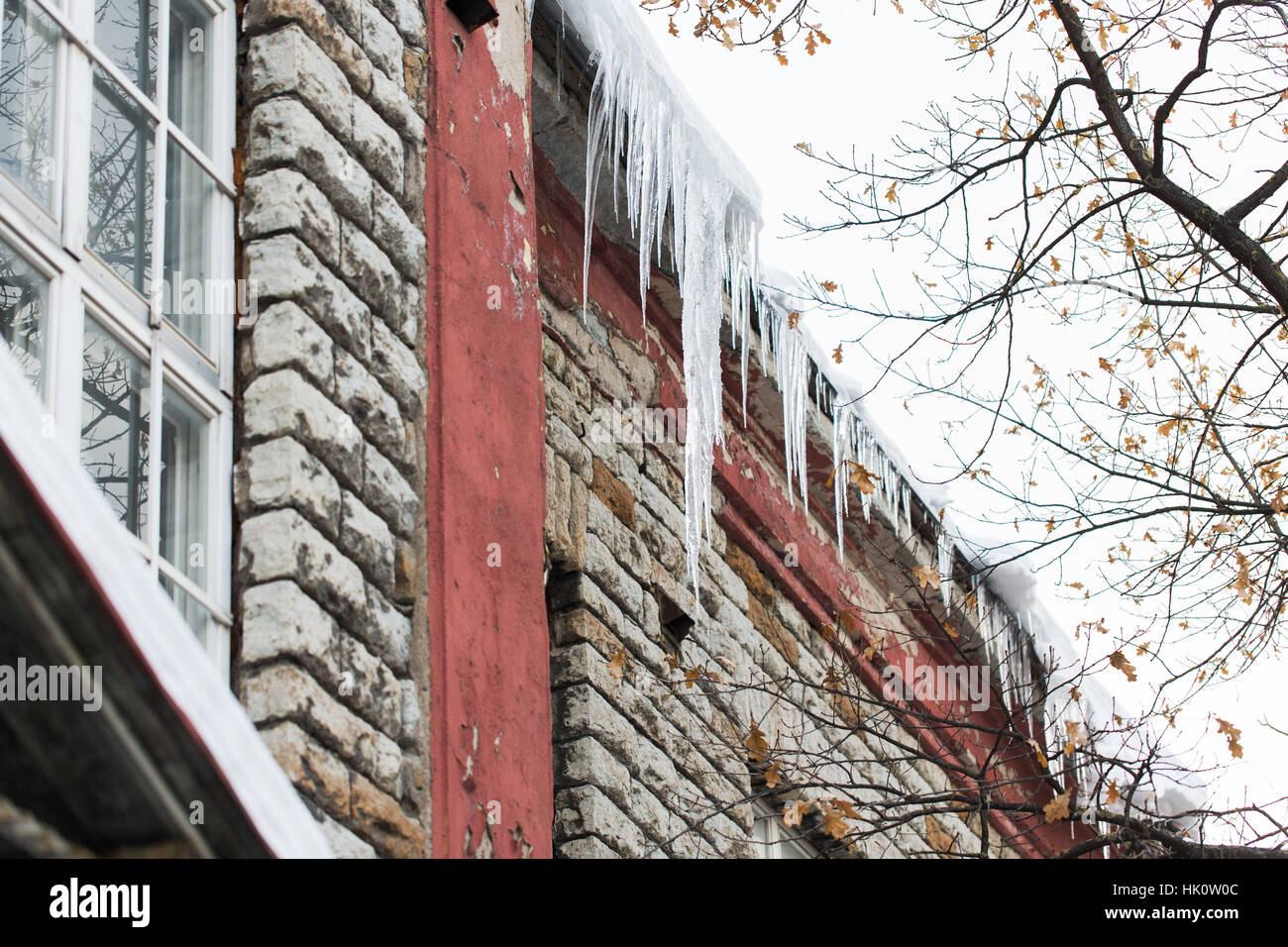 icicles on building or living house facade Stock Photo - Alamy