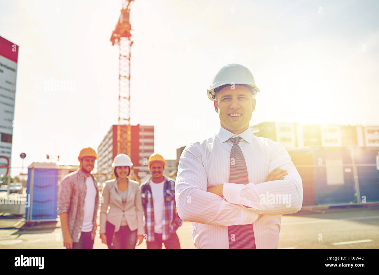 happy builders and architect at construction site Stock Photo - Alamy