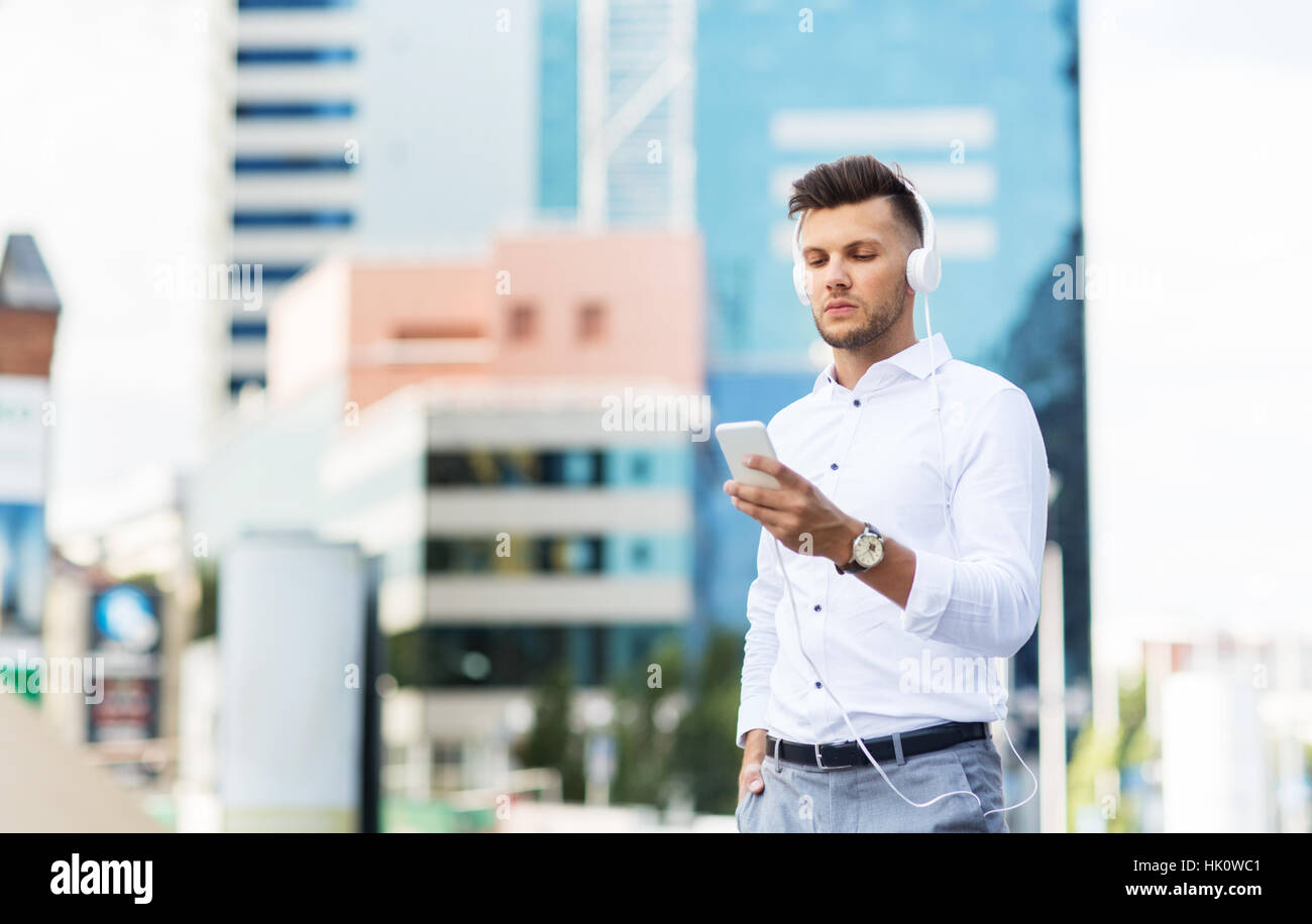 man with headphones and smartphone listening music Stock Photo - Alamy