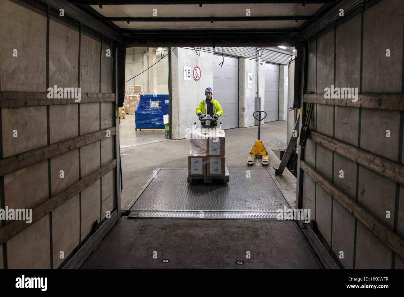 Loading a truck on the ramp Stock Photo - Alamy