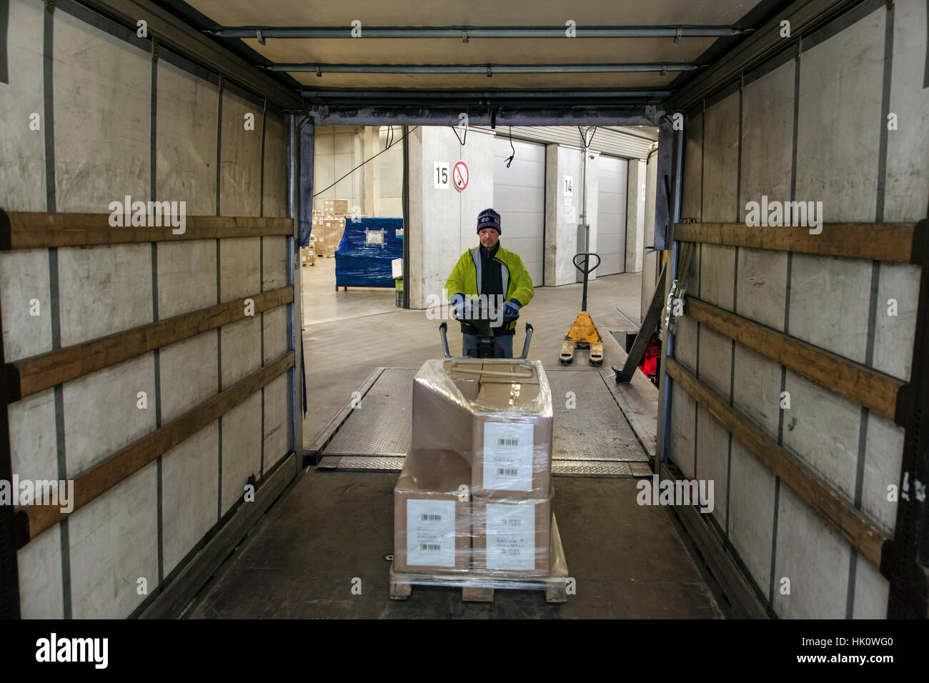 Loading a truck on the ramp Stock Photo - Alamy