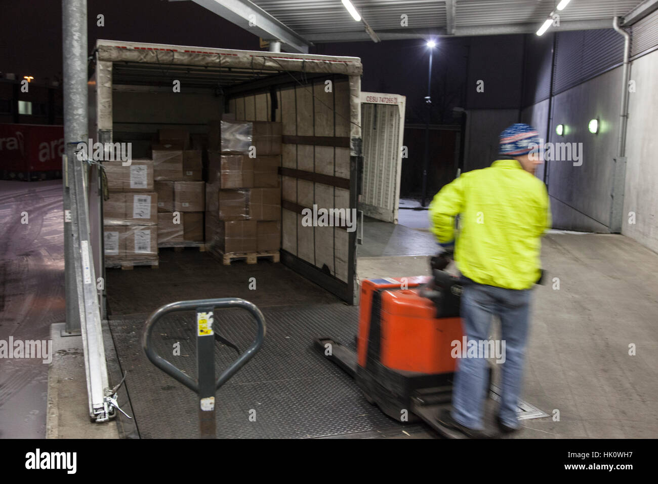 Loading a truck on the ramp Stock Photo - Alamy