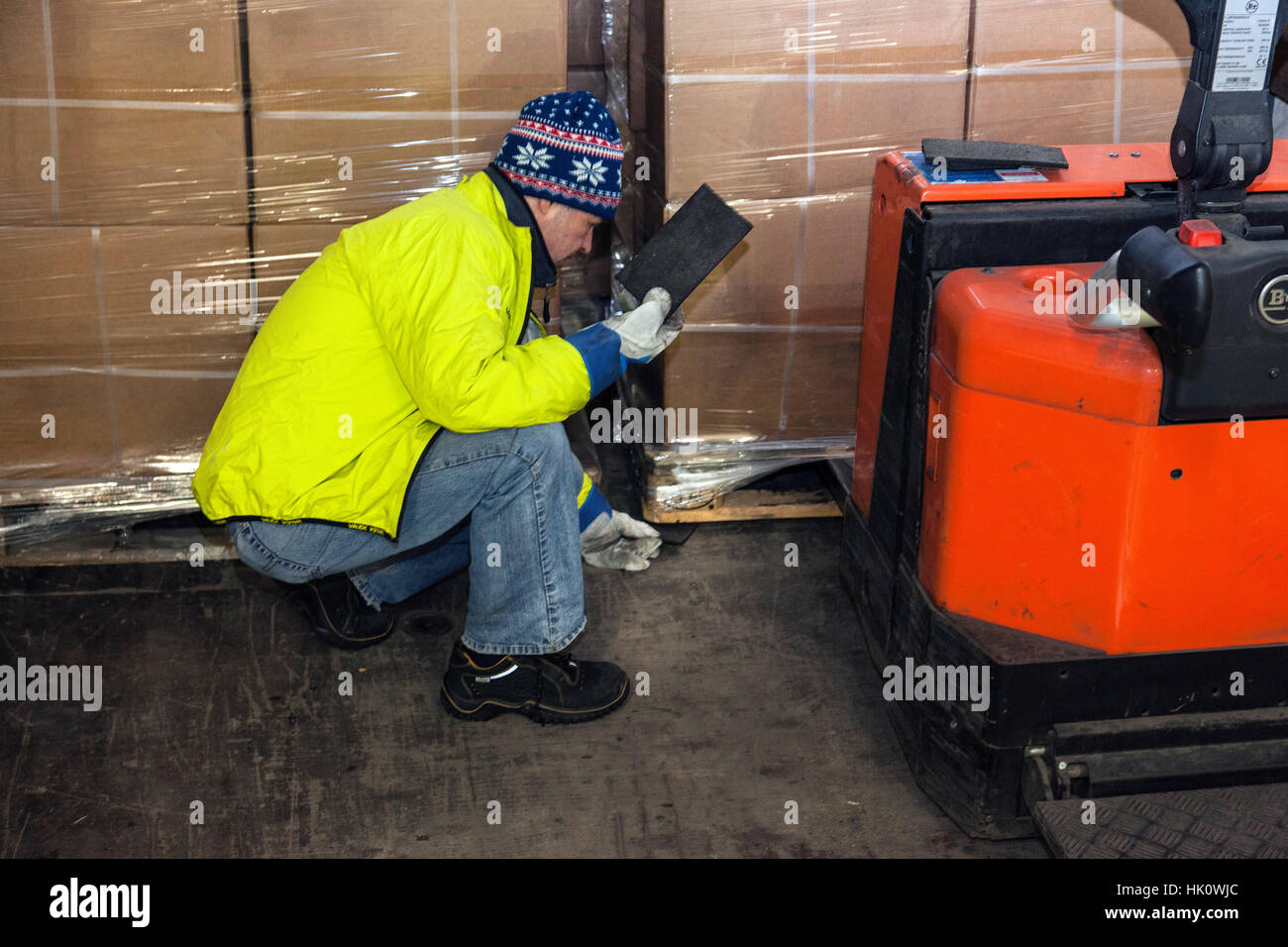 Loading a truck on the ramp Stock Photo - Alamy