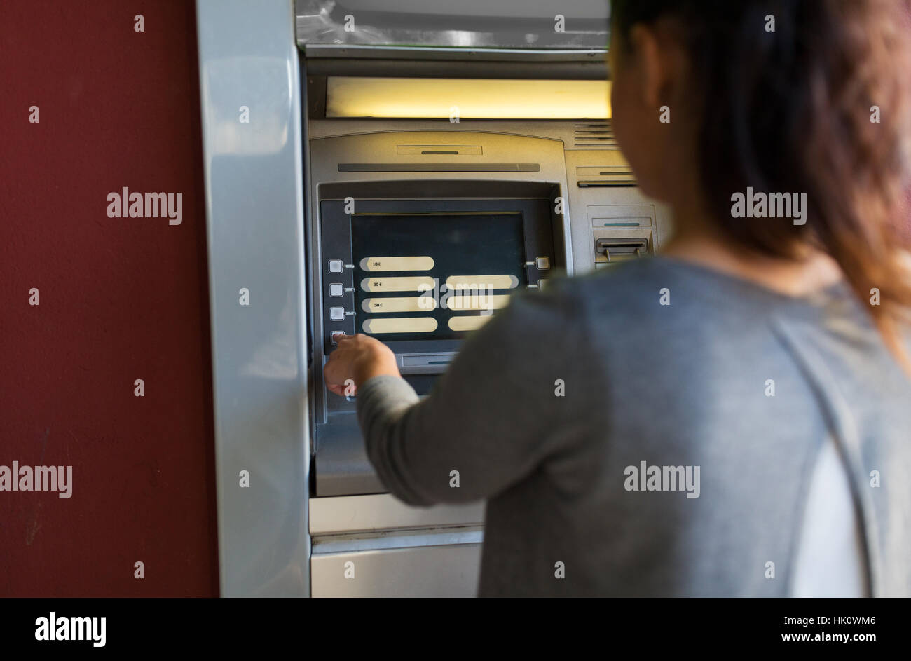 close up of woman choosing option on atm machine Stock Photo - Alamy