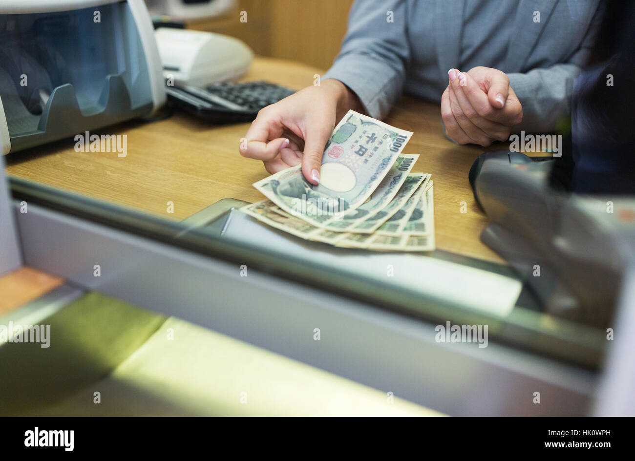 clerk counting cash money at bank office Stock Photo - Alamy