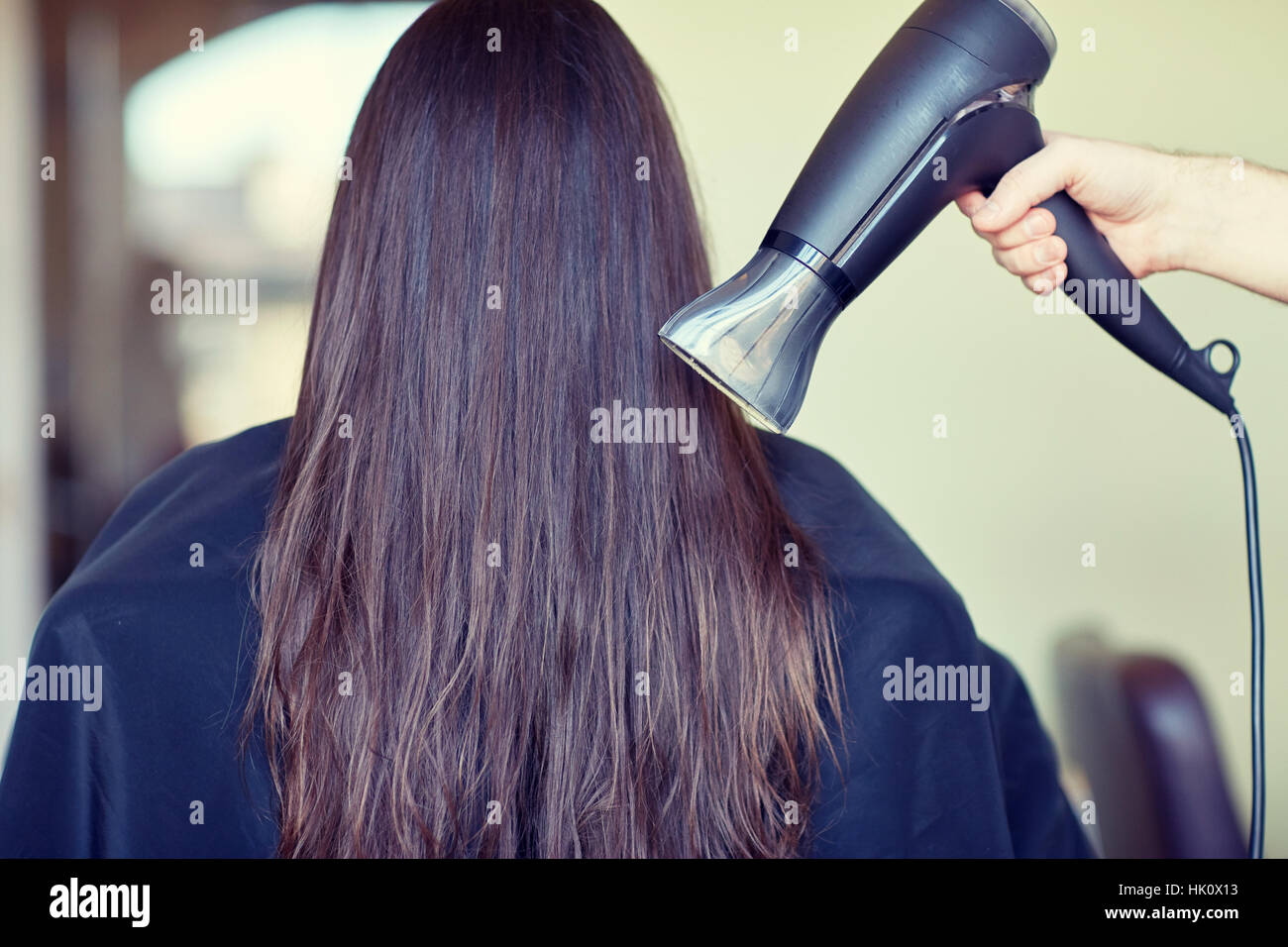 stylist hand with fan dries woman hair at salon Stock Photo - Alamy
