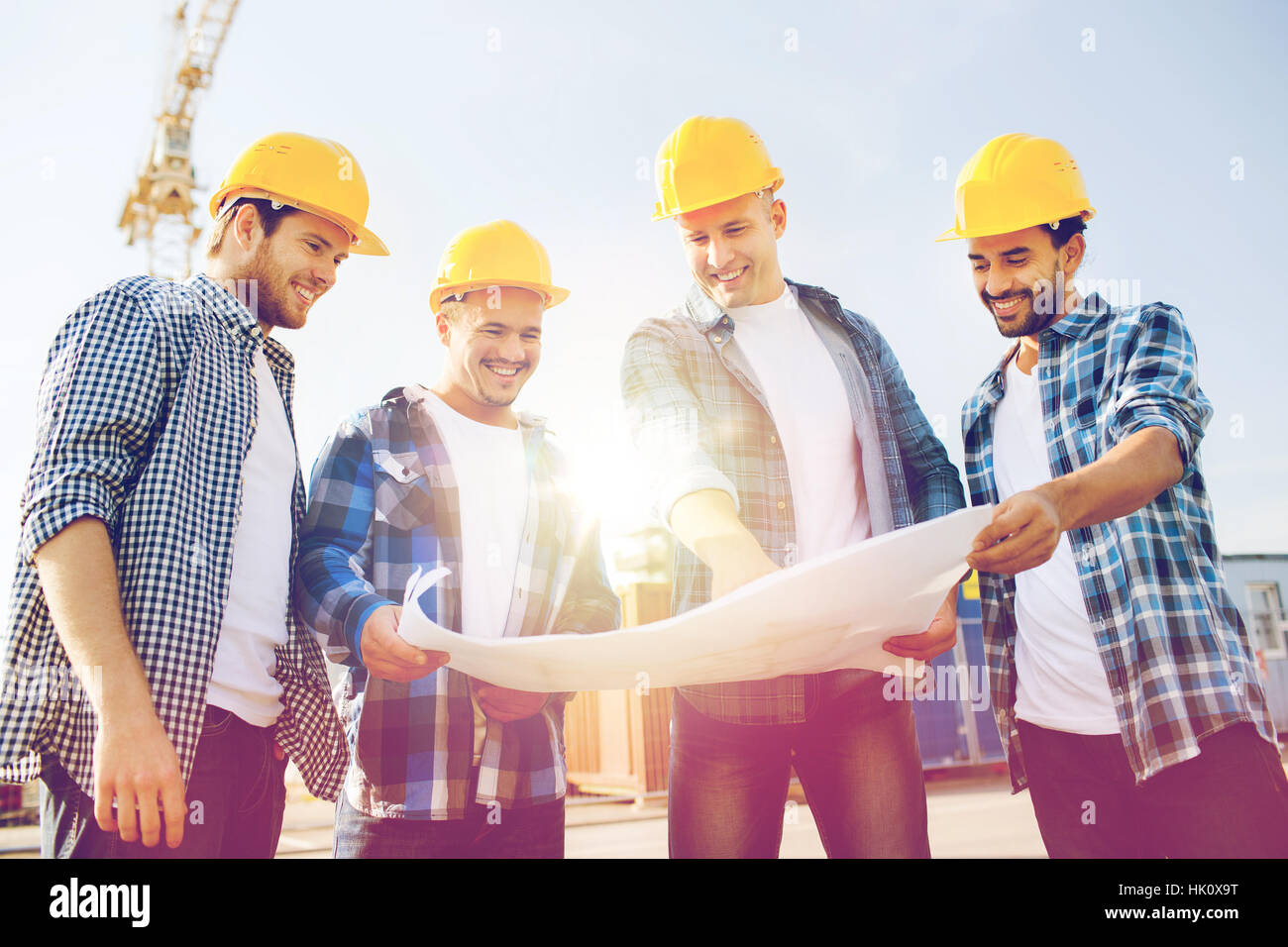 group of builders with tablet pc and blueprint Stock Photo - Alamy