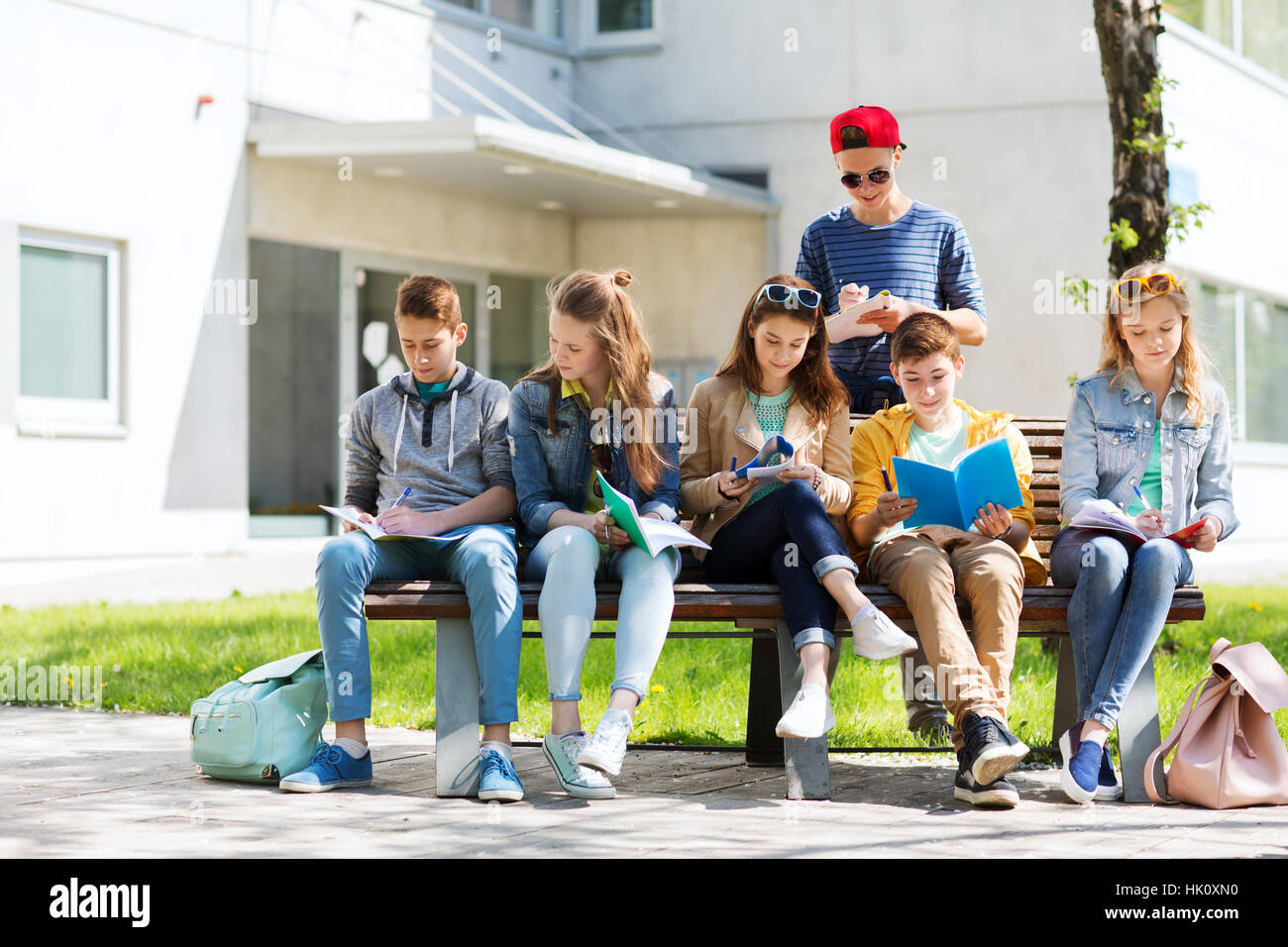 group of students with notebooks at school yard Stock Photo - Alamy