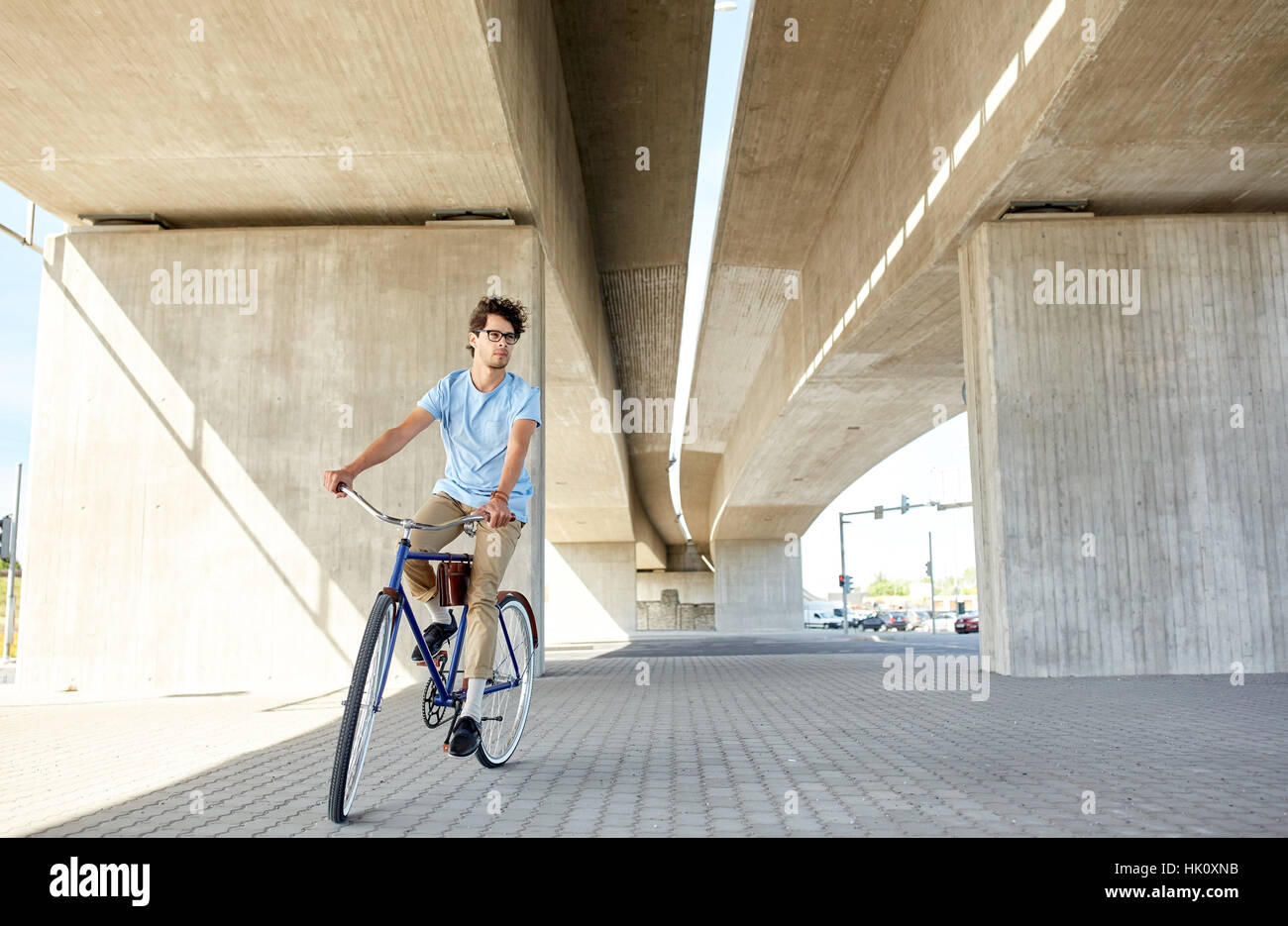 young hipster man riding fixed gear bike Stock Photo - Alamy