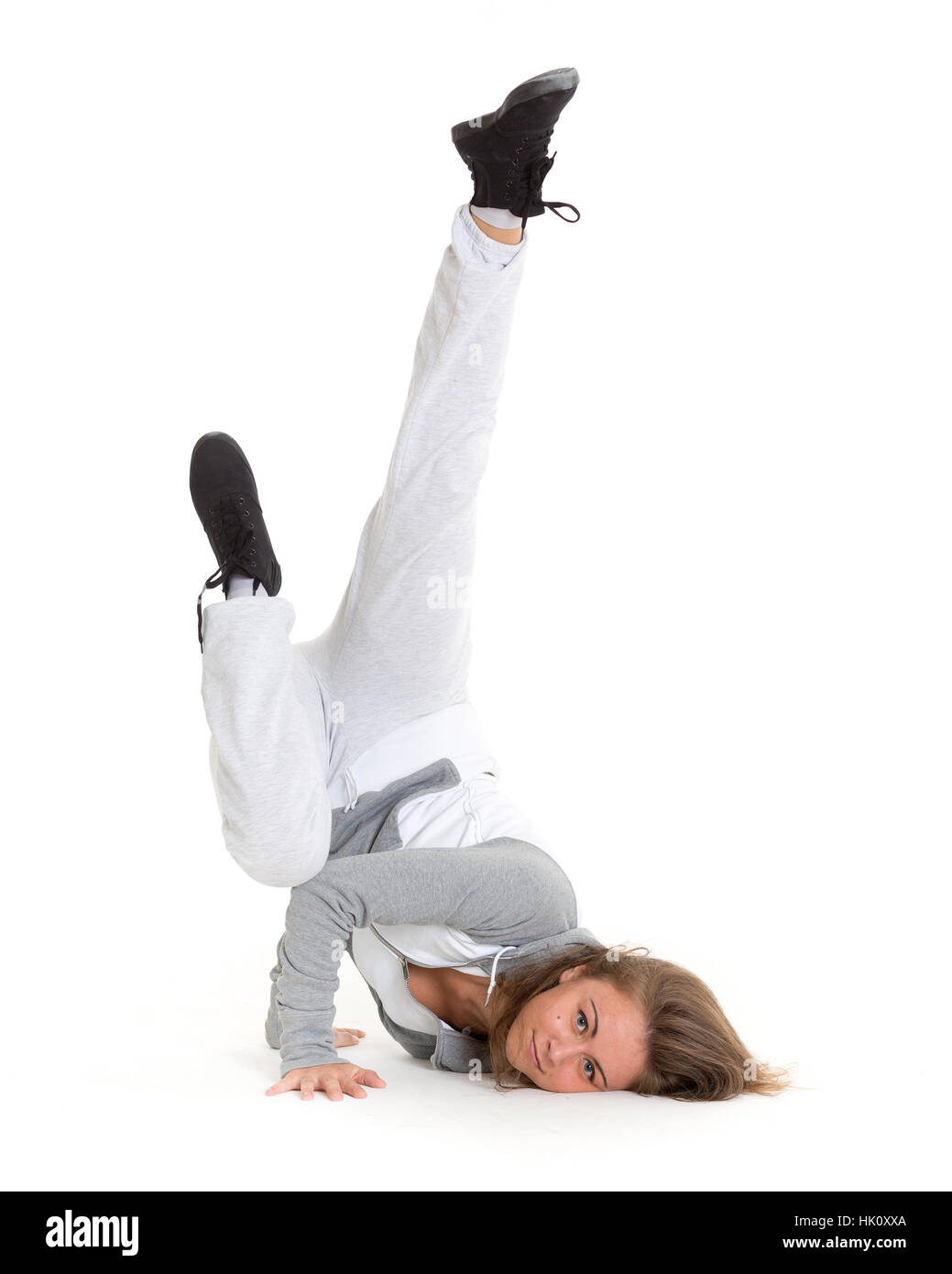 The beautiful sporty girl dancing on a white background. Modern dances ...