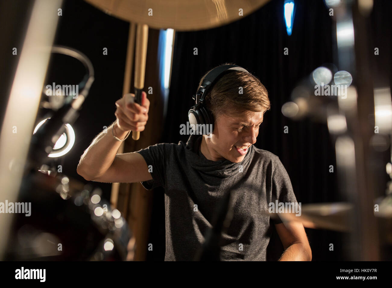 male musician playing drums and cymbals at concert Stock Photo - Alamy