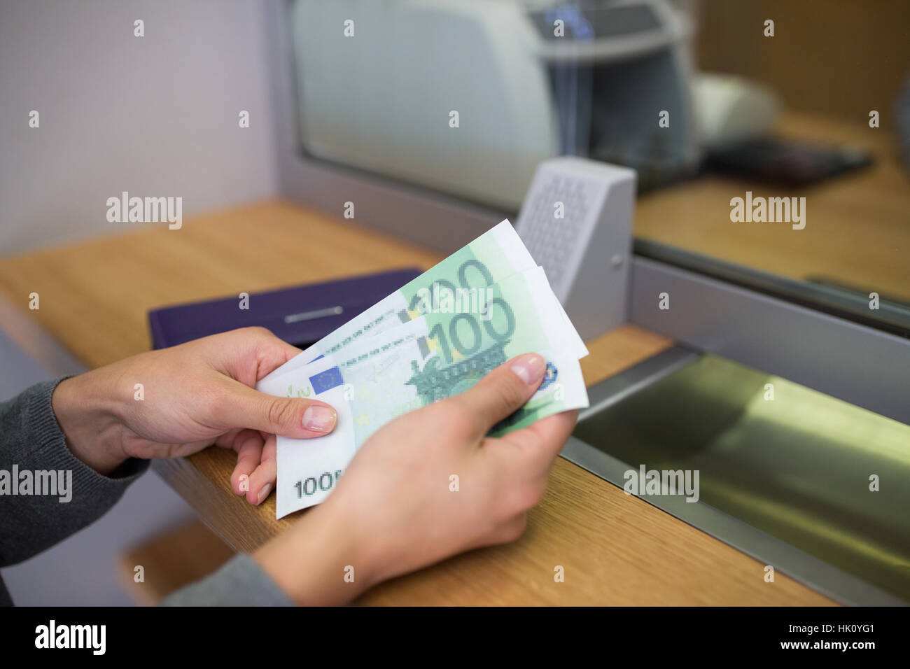 hands with money at bank or currency exchanger Stock Photo - Alamy