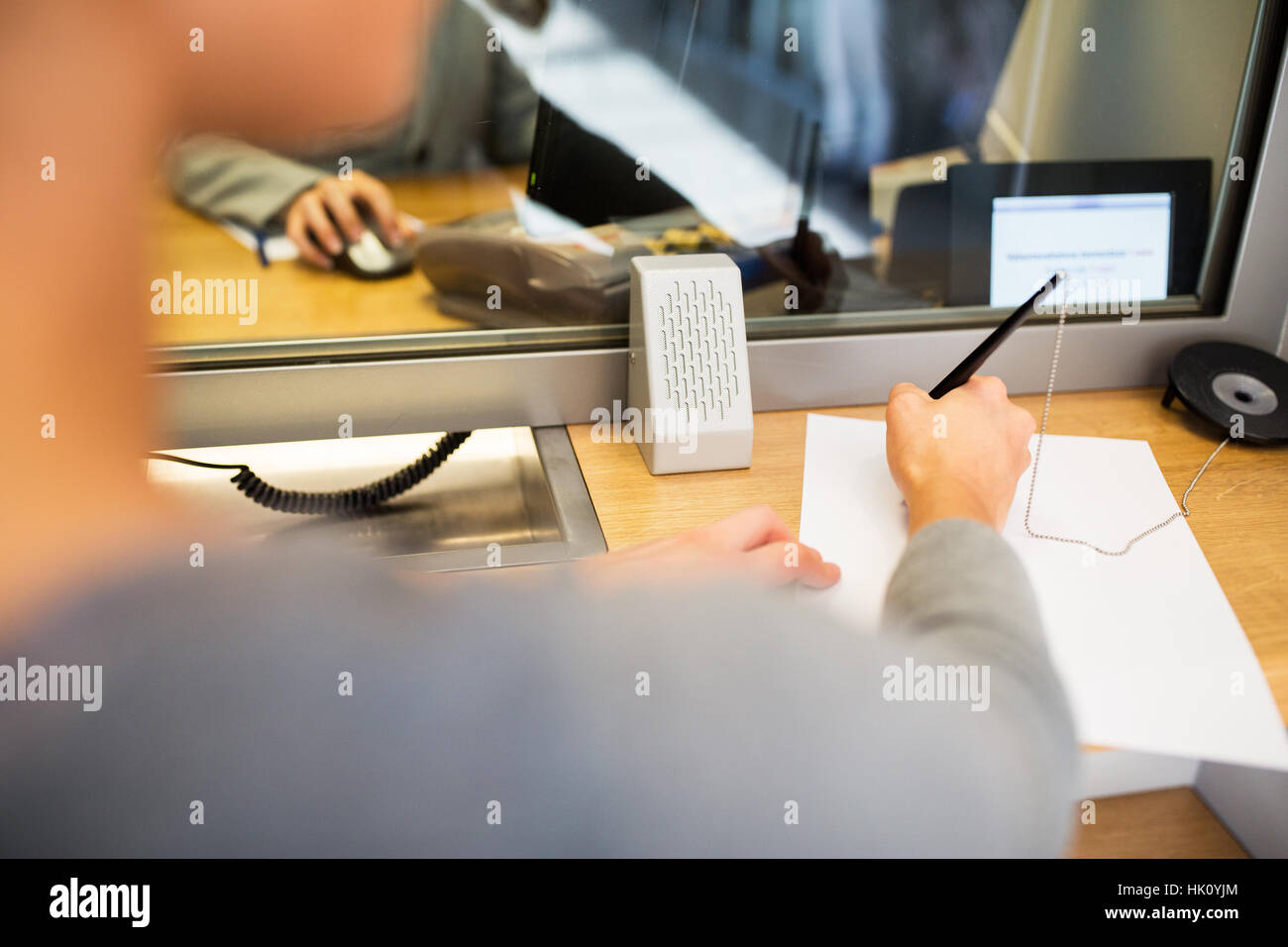 customer writing application at bank office Stock Photo - Alamy