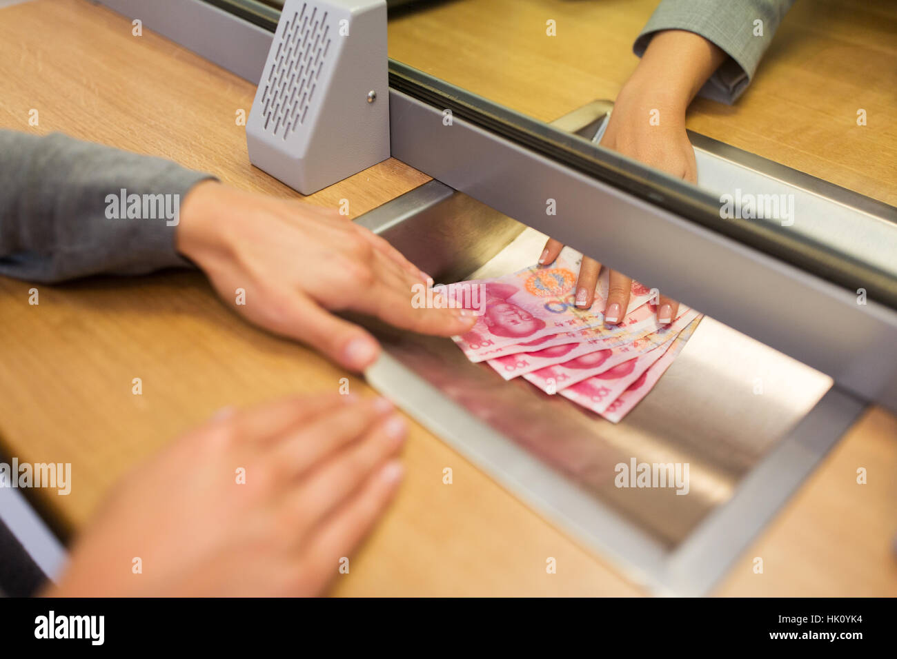 clerk giving cash money to customer at bank office Stock Photo - Alamy